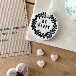 Porcelain be happy token – Amanda Mercer